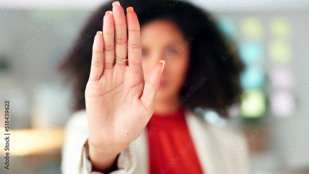 Serious human resources manager gesturing stop with her hand in the ...
