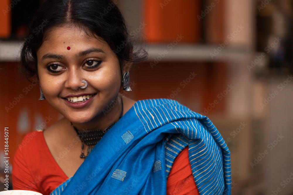 Happy and expressive young Indian woman with nice facial expression ...