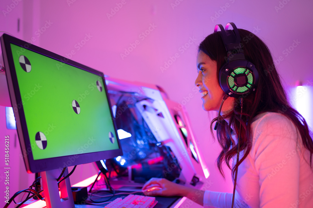 Happy young pretty Asian transsexual transgender gamer wearing a gaming ...