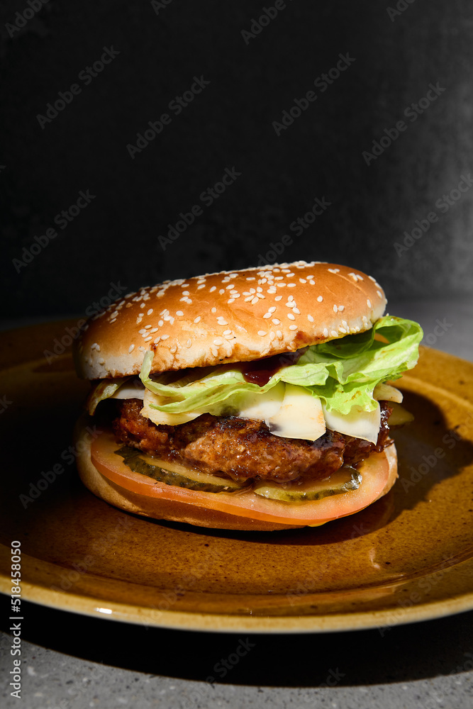 Classic american burger on ceramic plate in dark minimal style. Beef ...