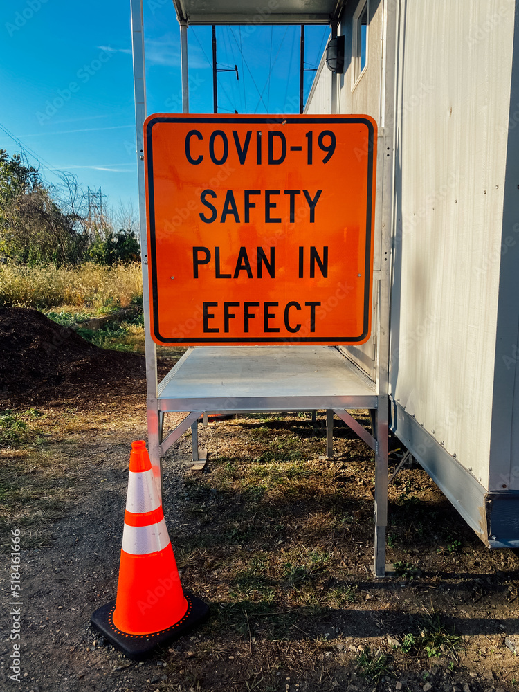Covid-19 Safety Plan Sign on the side of a construction office Stock ...