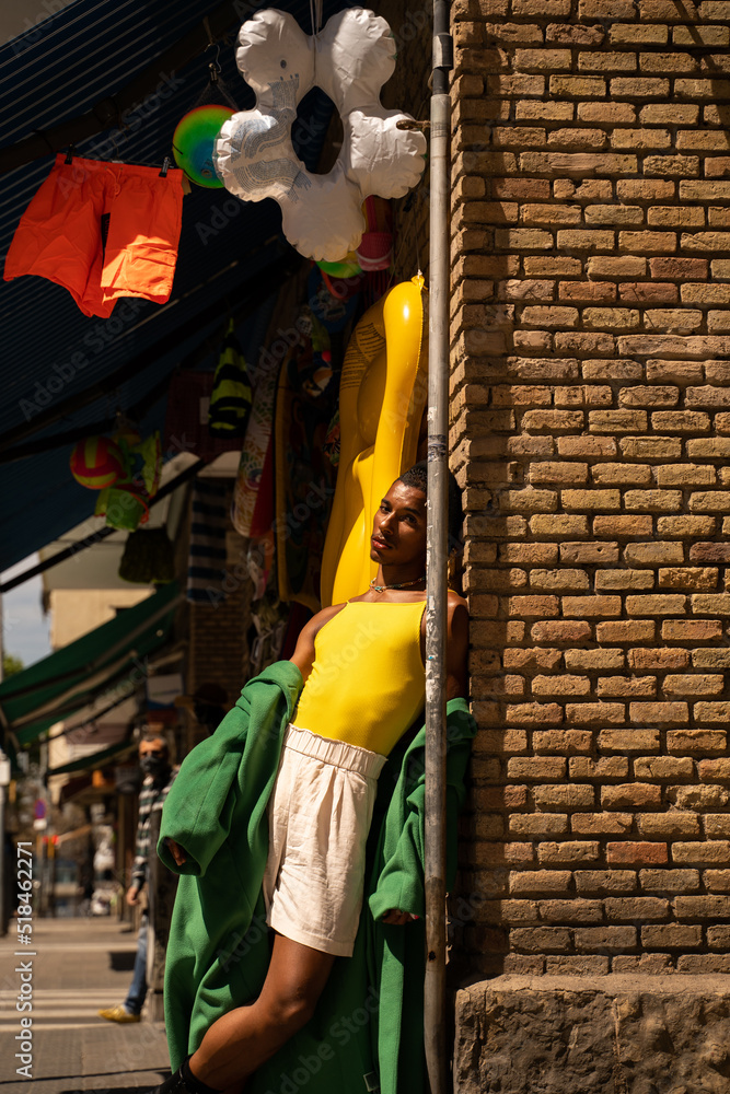 Fancy queer black man posing at street corner Stock Photo | Adobe Stock