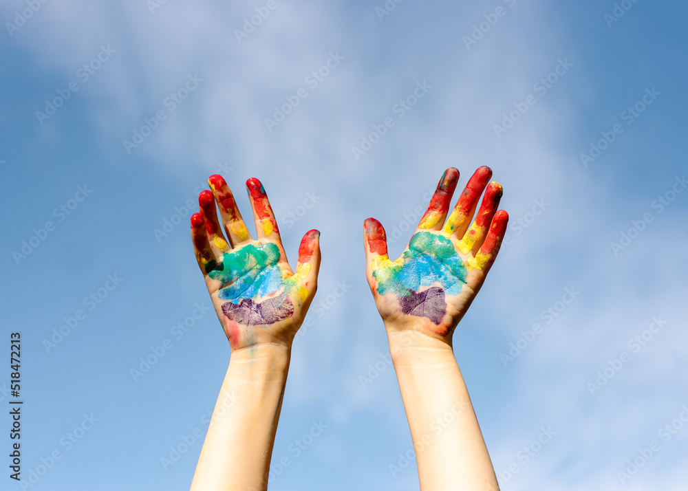 rainbow hands with blue sky Stock Photo | Adobe Stock