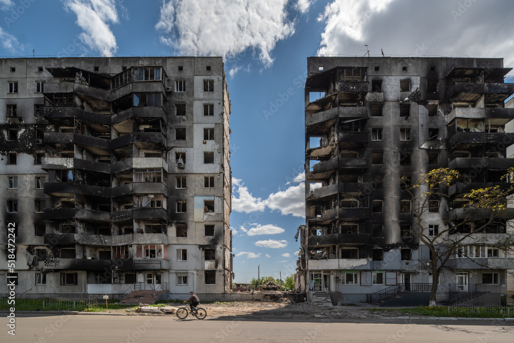 Facade of a bombed-out apartment building. Stock Photo | Adobe Stock