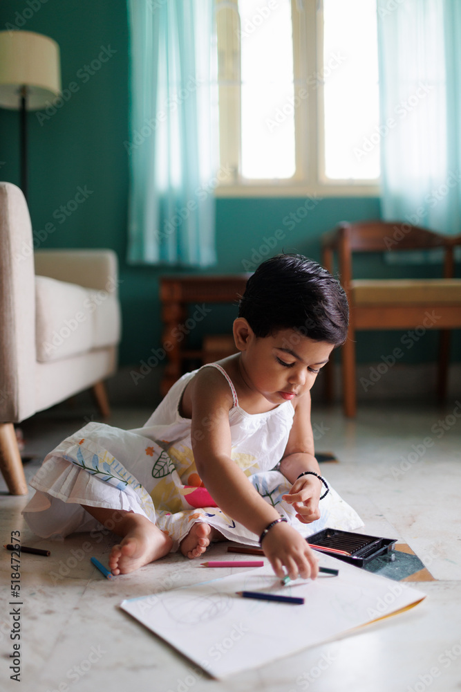 Cute little girl playing with color pencils, learning to draw Stock ...