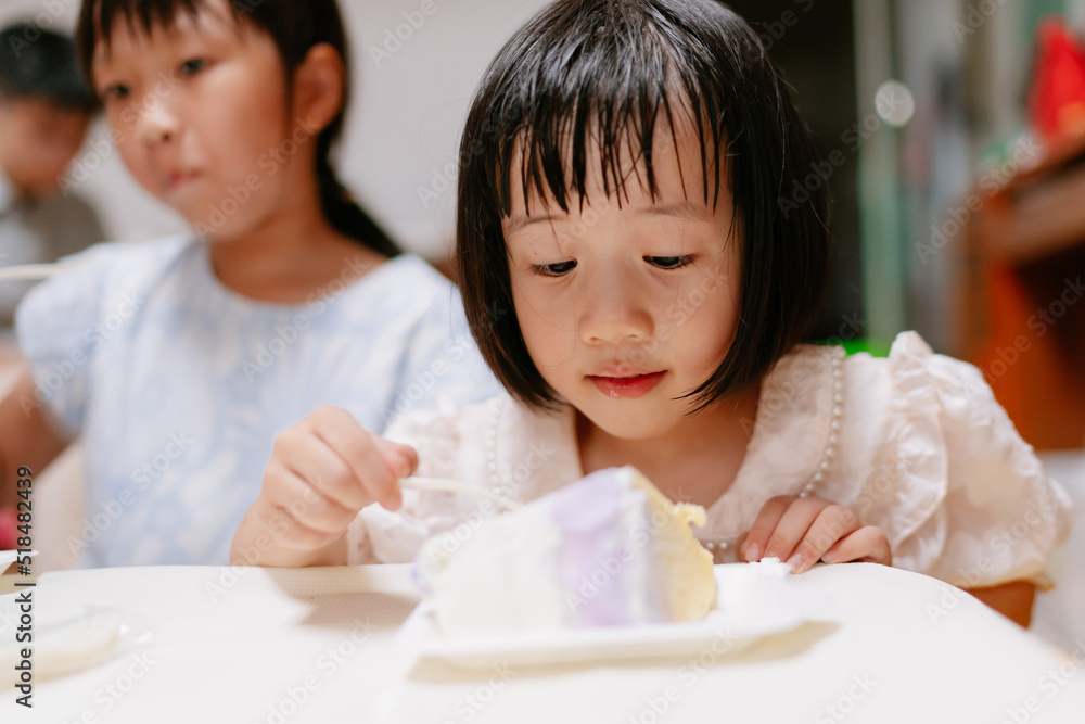 children sharing birthday cake Stock Photo | Adobe Stock