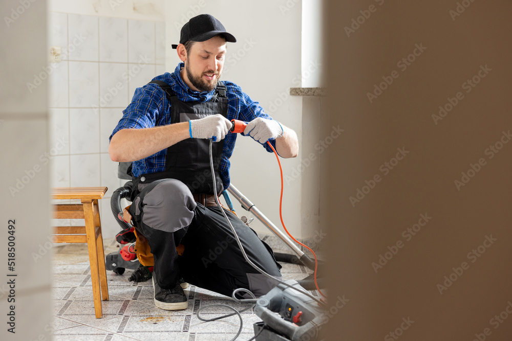 Connecting cables with a plug, extension cord plugging in construction ...