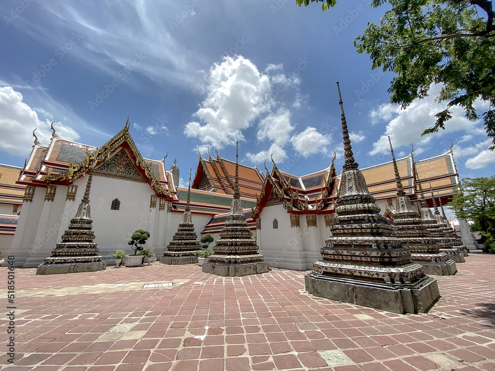 Wat Pho Temple in Bangkok, Thailand with stone pyramid towers, lying ...