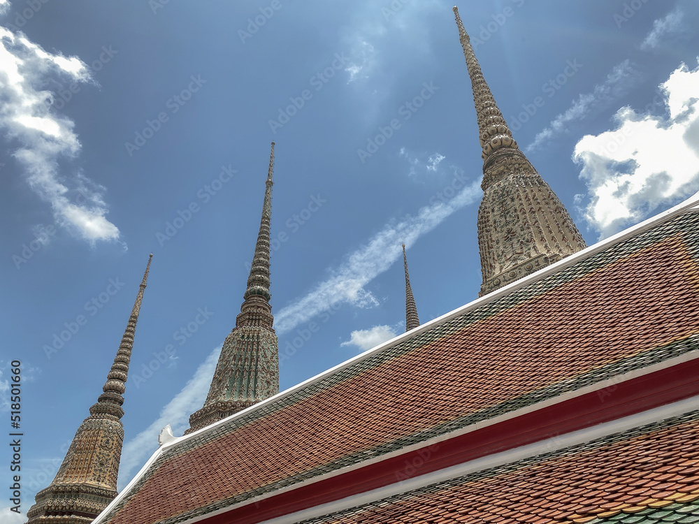Wat Pho Temple in Bangkok, Thailand with stone pyramid towers, lying ...
