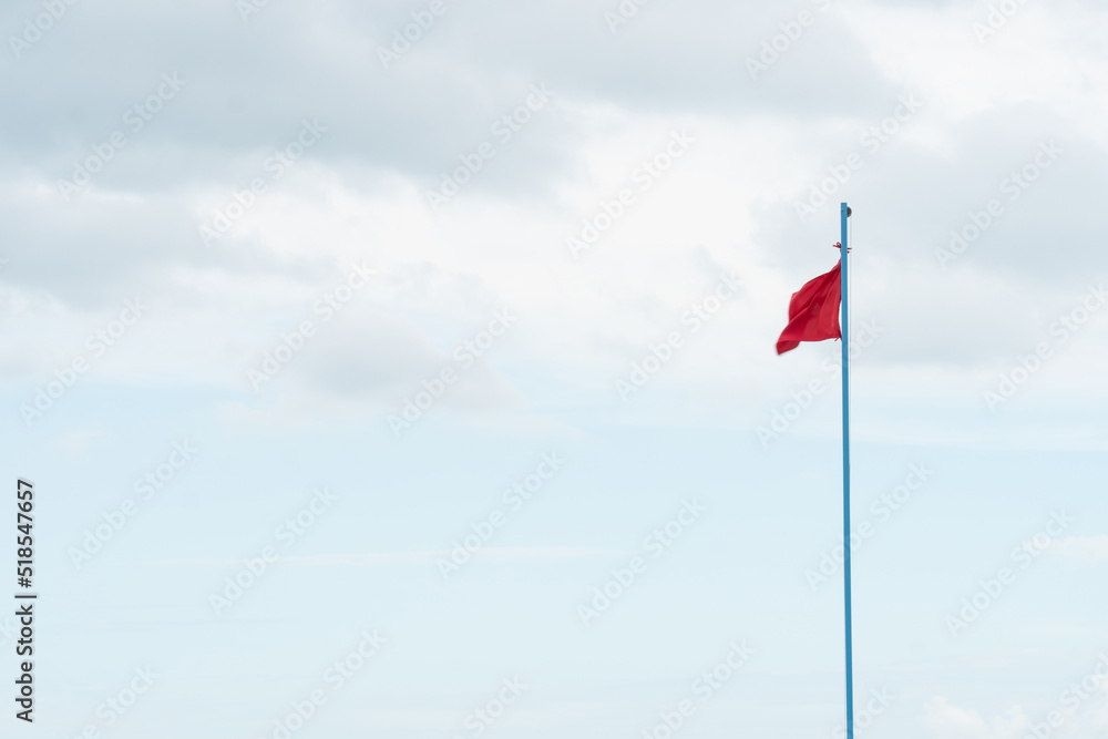 Flag warning beach dangerous red wind blue sky sand day, concept white ...