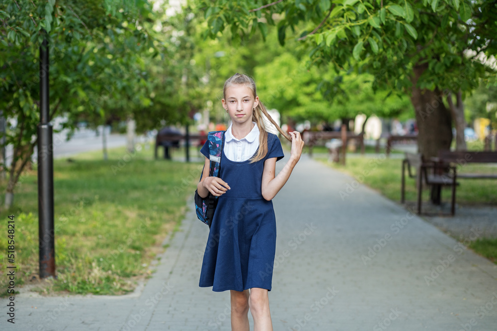 Beautiful preteen girl with backpack goes to school. Concept of back to ...