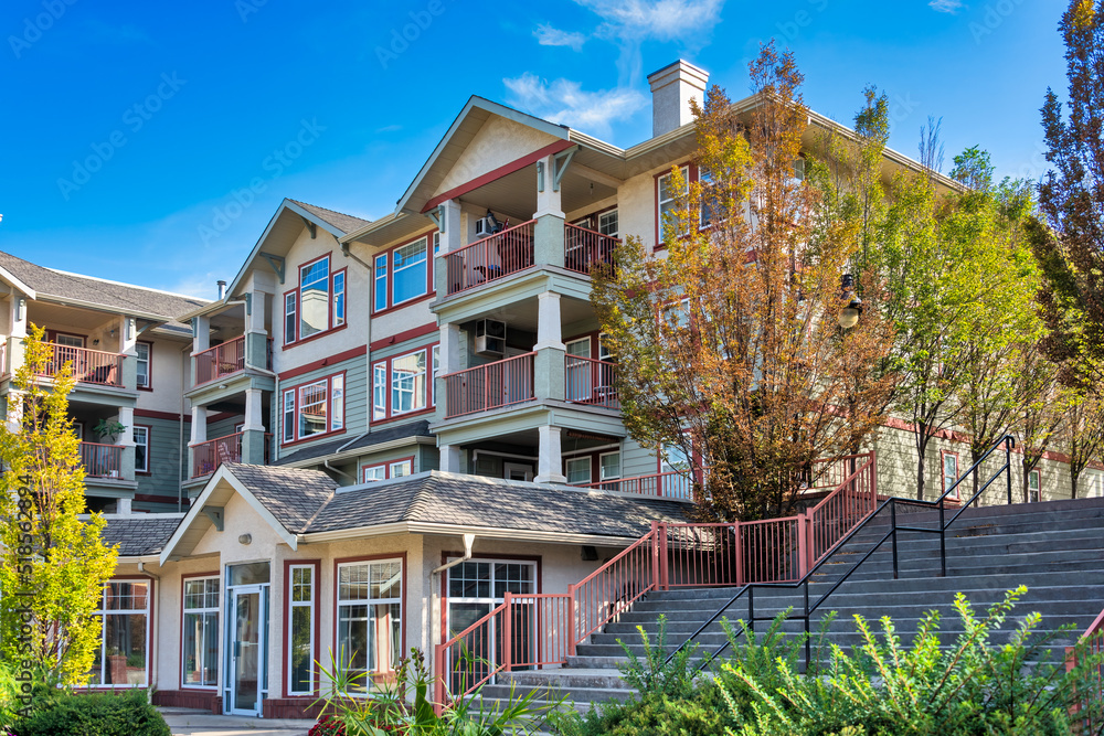 Low-rise residential building with stairs on the side through the land ...