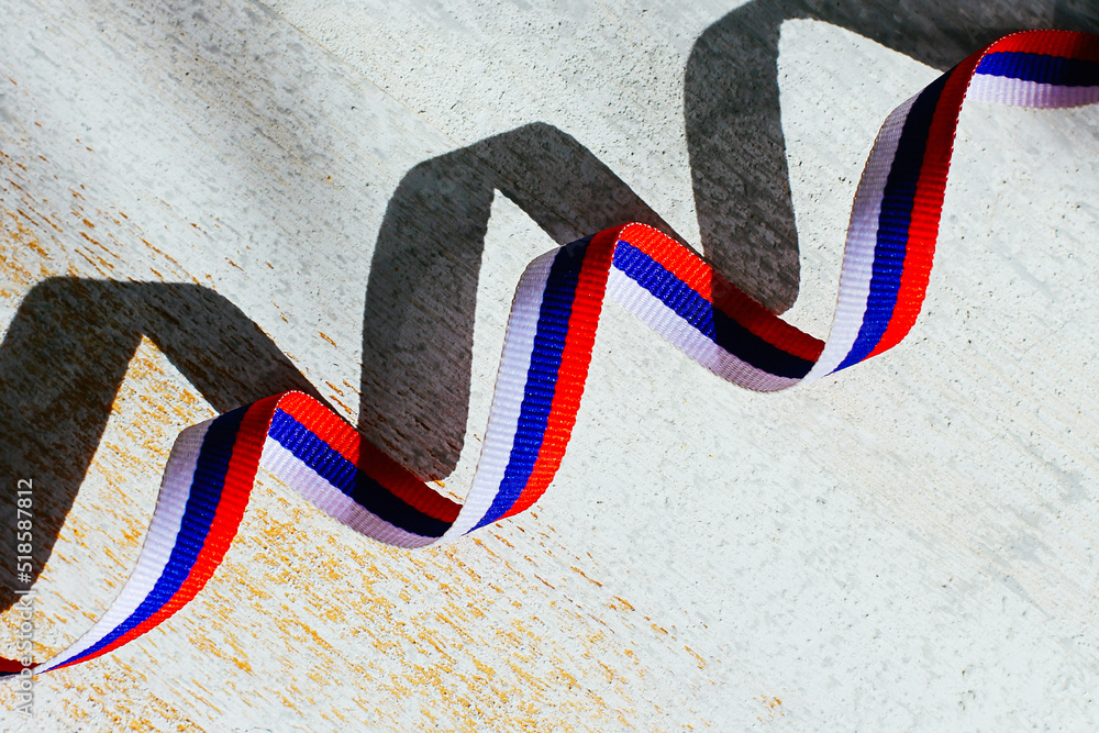 Russian flag tricolour, symbol of Russia. The ribbon is painted in the ...