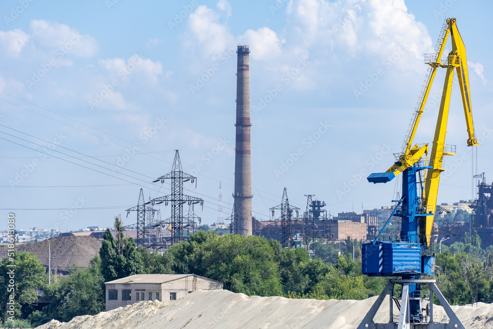 Big port cranes on the river. Extraction and transportation sand ...