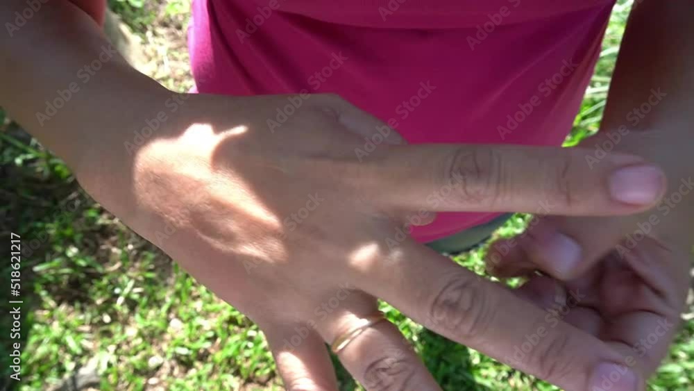 close up the hand of a woman who is wearing a ring on her ring finger ...