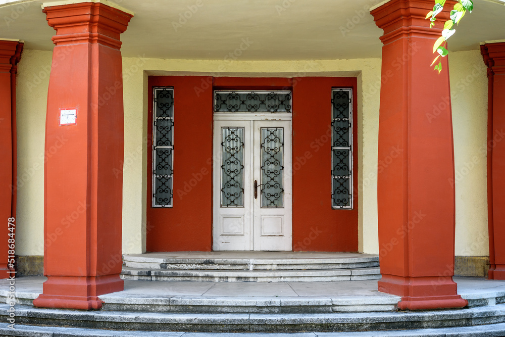 Front of the old building (facade), historic wooden door (gate ...