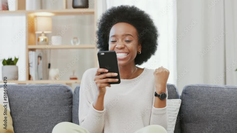 Shocked woman shouting and cheering with joy while reading an email ...