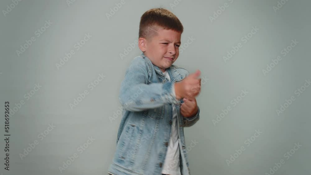 Toddler boy mime pulling an imaginary unreal invisible rope, puts lot ...