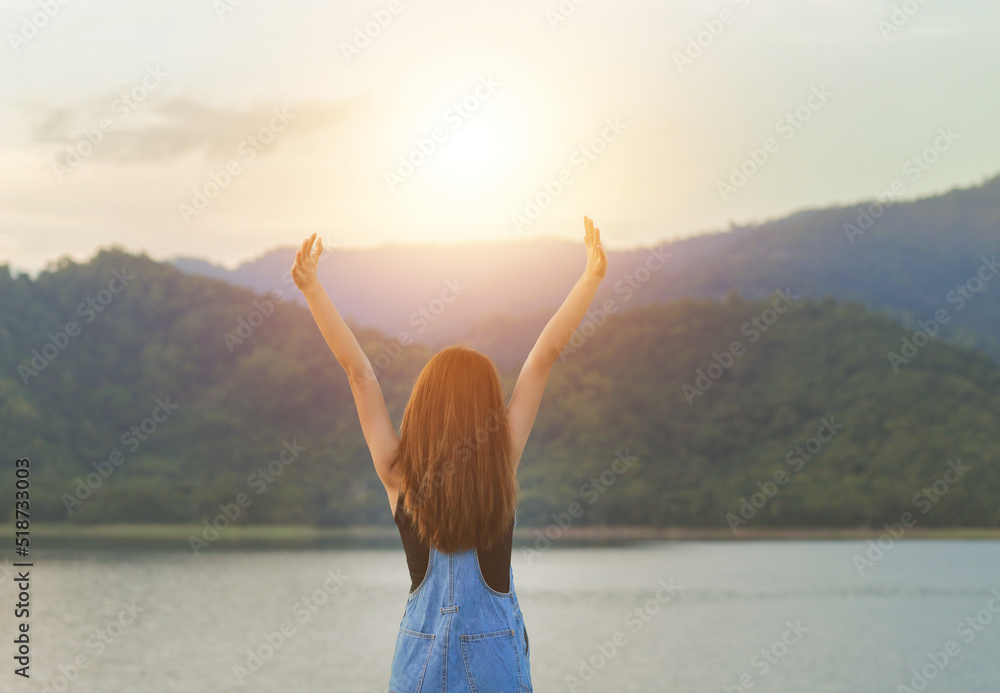 beautiful girl relaxing with nature,mountain and lake as background ...
