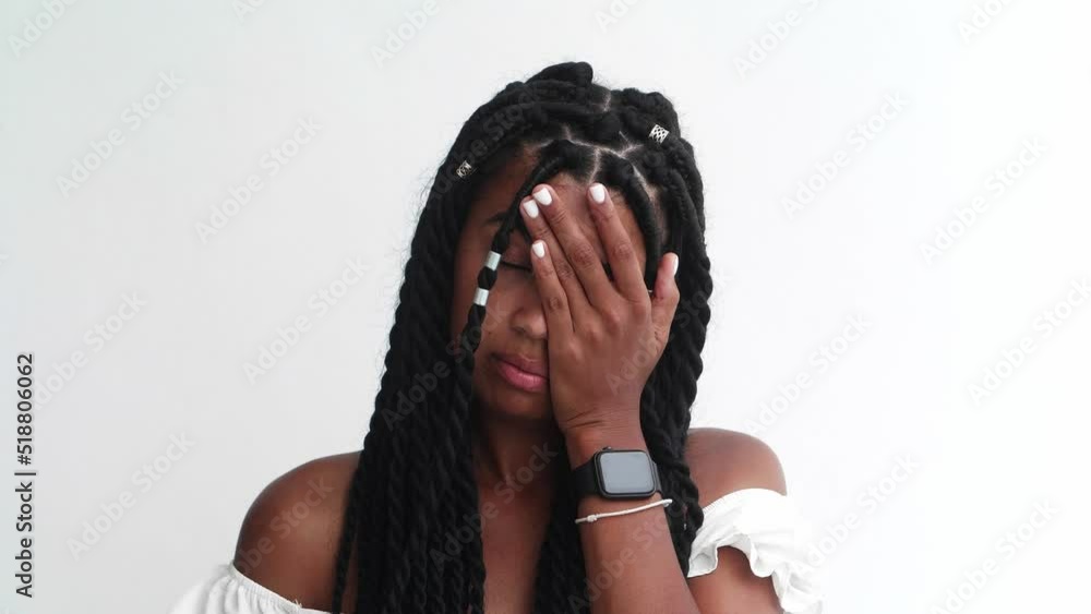 Focus on facial expression of a young bored and frustrated multi-ethnic ...