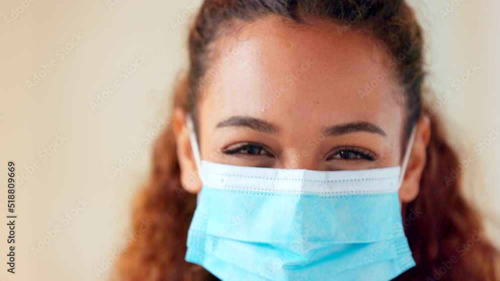 Closeup of a doctor wearing face mask to protect against viral spread ...