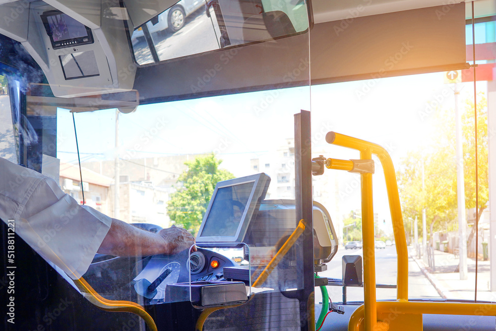 Hands of driver in a modern bus by driving in Europe. Close-up of bus ...