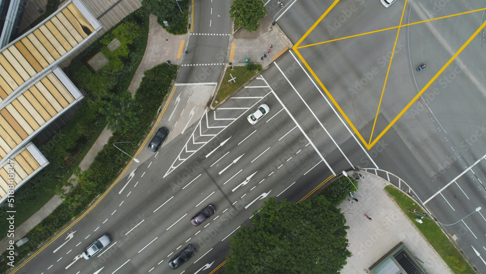 Top view of a city intersection with a bus, cars and people crossing ...
