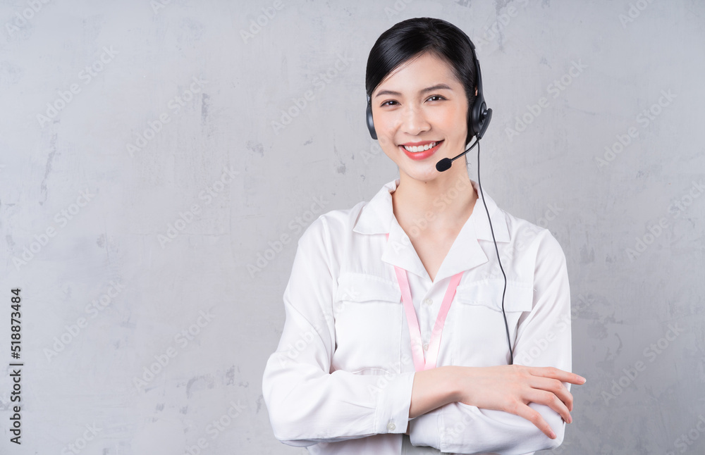 Portrait of young Asian operator on background Stock Photo | Adobe Stock