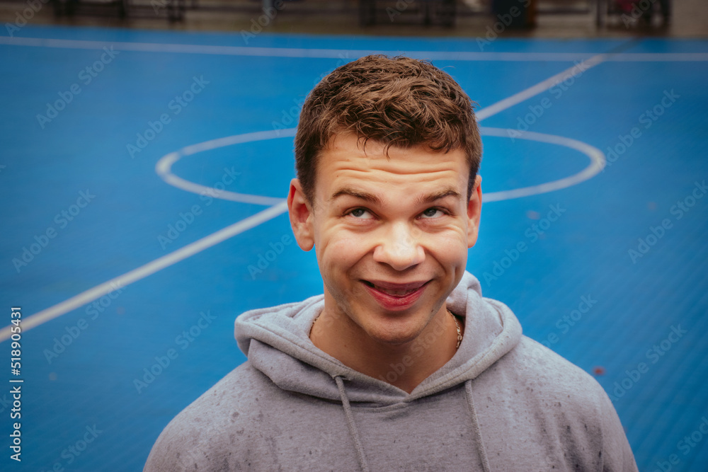 Young smiling Caucasian man making funny face expression having fun on ...