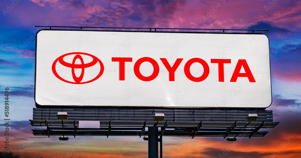 Advertisement billboard displaying logo of Toyota Stock Photo | Adobe Stock