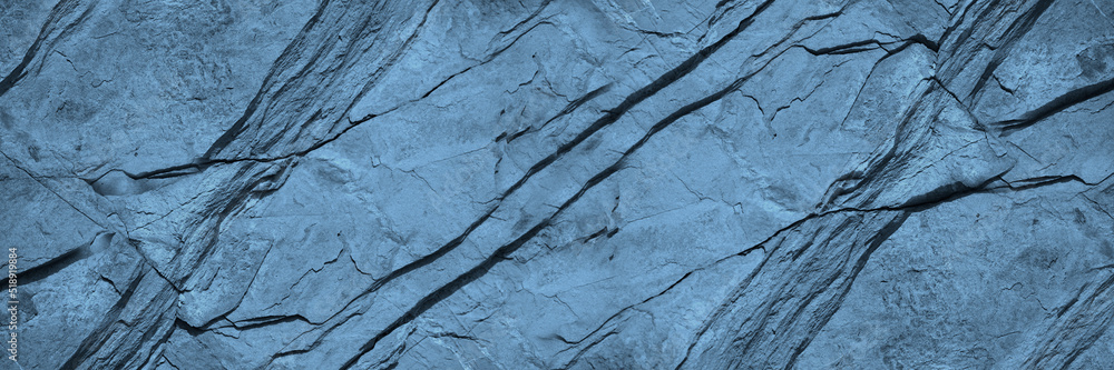 Gray blue rock texture. Rough mountain surface with cracks. Close-up ...