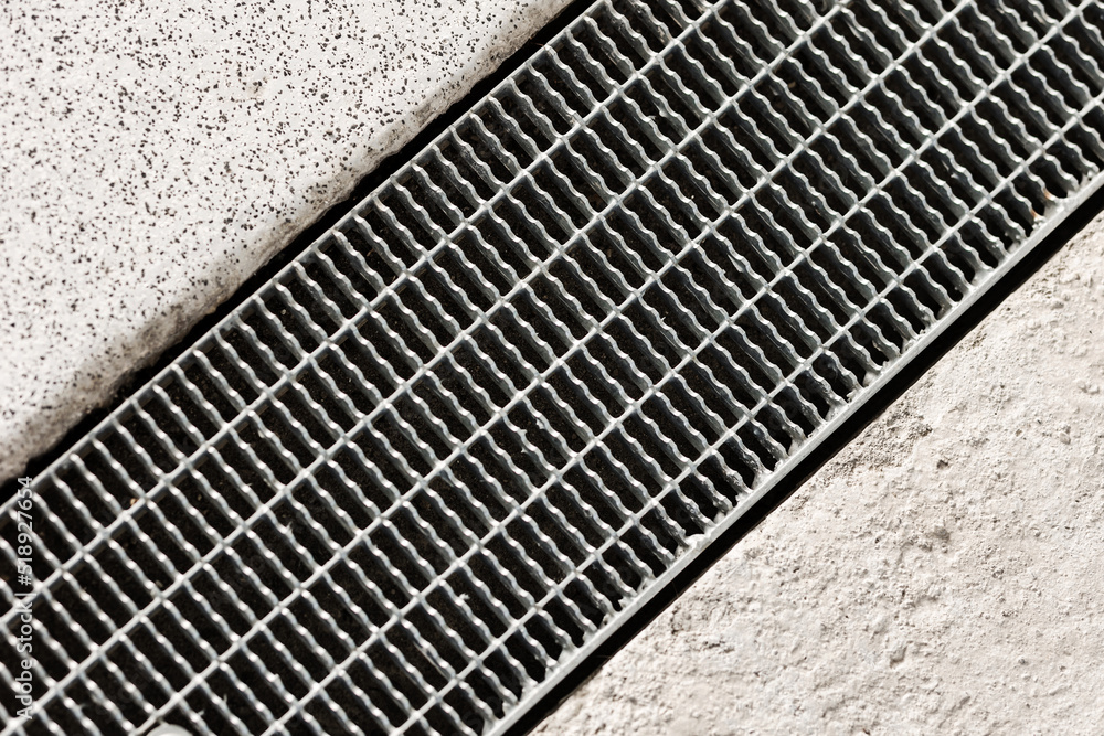 Drainage mech on paving. Sewerage system and Drain Grate on Ground for ...