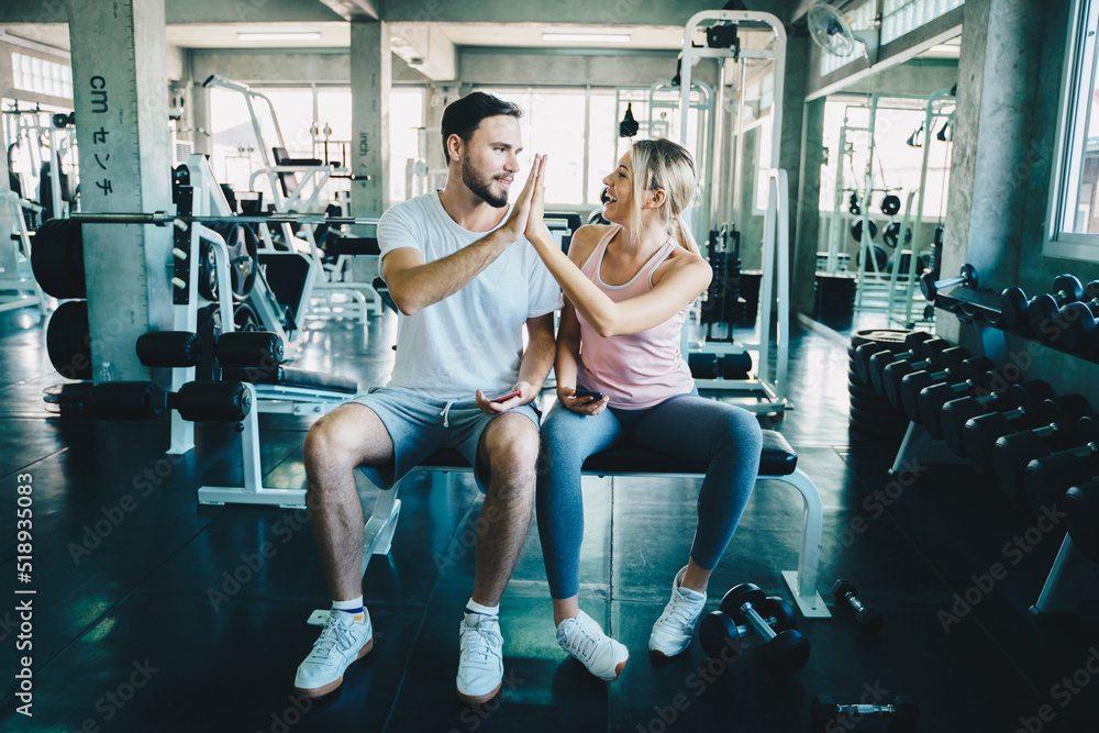 Smart sport man and woman working out in fitness gym Stock Photo ...