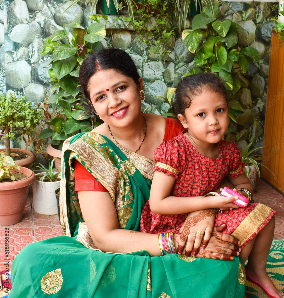 Happy motherhood. Portrait of loving Indian mother and daughter in ...