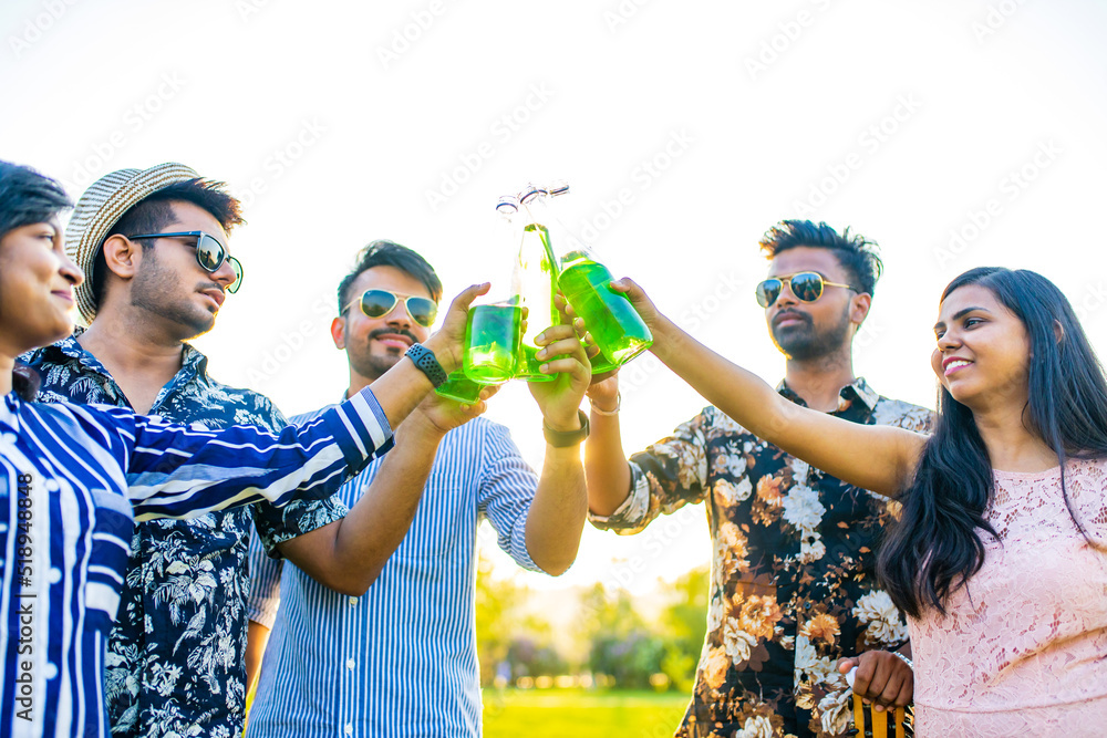 pakistanian happy best friends partying with lemonade and beer in ...