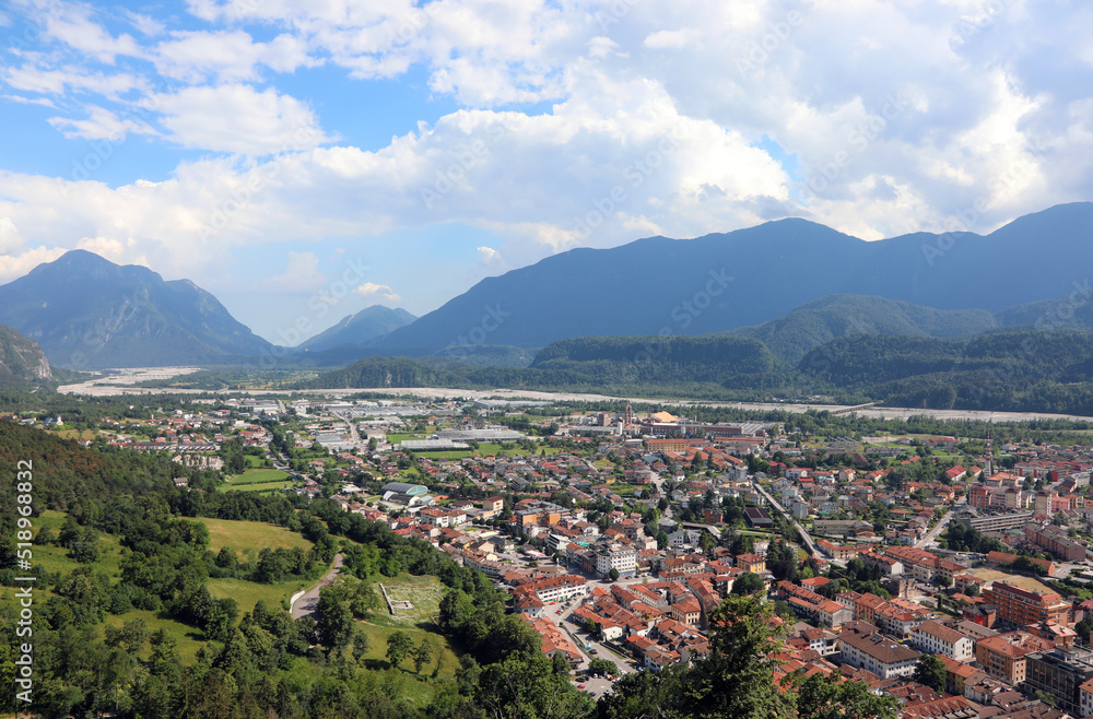 panorama of the city of Tolmezzo and a valley in the Alps mountains of ...