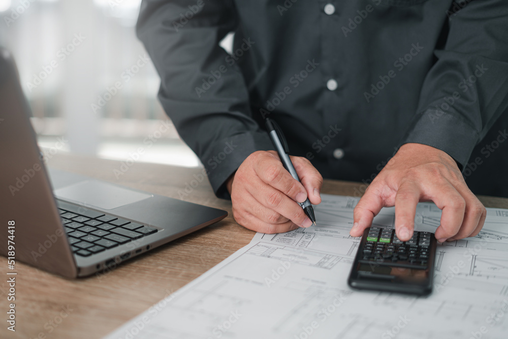 Engineering work concept: Close up hand a use pen mark CAD drawing and ...