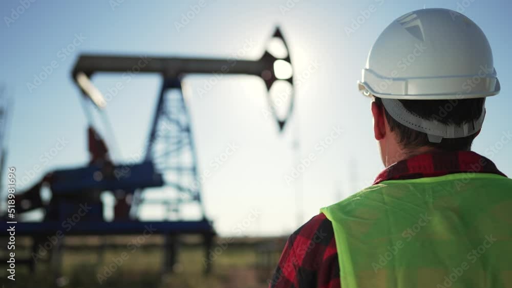 Oil pump.Engineer work with laptop and diagram.Checking operation of ...