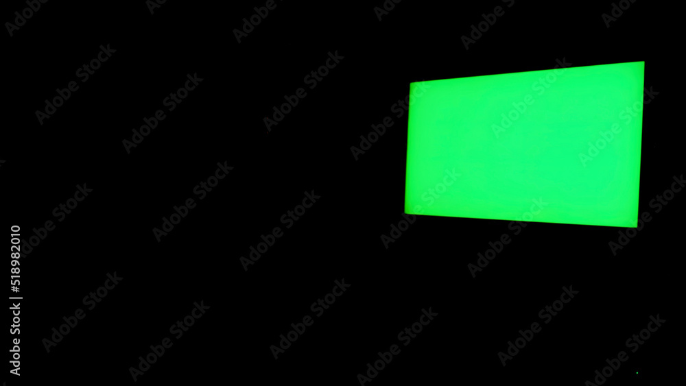 Green screen isolated on black background. Concept. TV with glowing ...