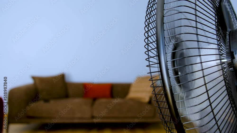 Home type fan cooler, propellers turning and fan is swinging left to ...