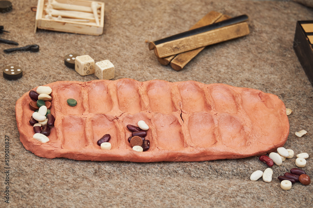 African game of kalah, popular in ancient Rome. Reconstruction of board ...