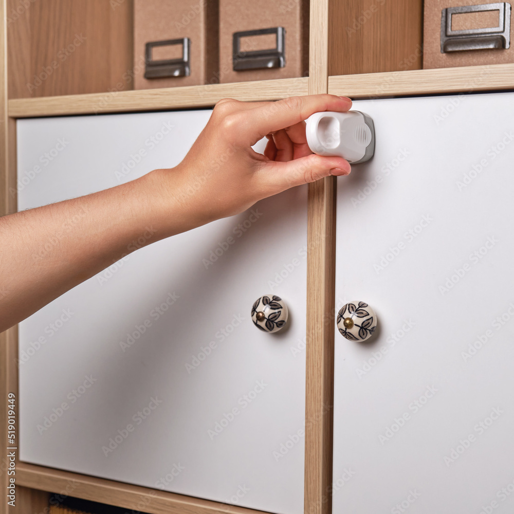 Opening the magnetic lock key to protect the cabinet doors and drawers ...