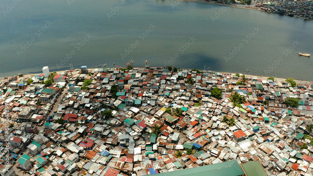 Dense building houses in the slums of Manila top view. Overpopulated ...