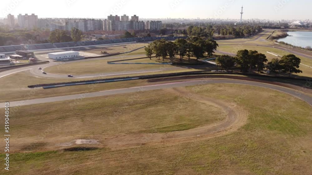 Aerial view of Autodromo Racetrack with driving race cars on asphalt ...