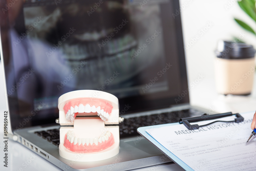 Oral dental. Dentist doctor in uniform writing information of patient ...