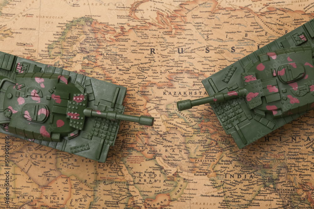 Toy tanks on a vintage word map. Stock Photo | Adobe Stock