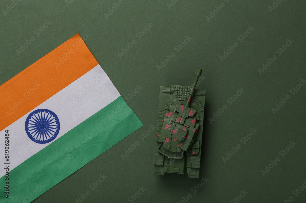 Toy tank with India flag on green background Stock Photo | Adobe Stock