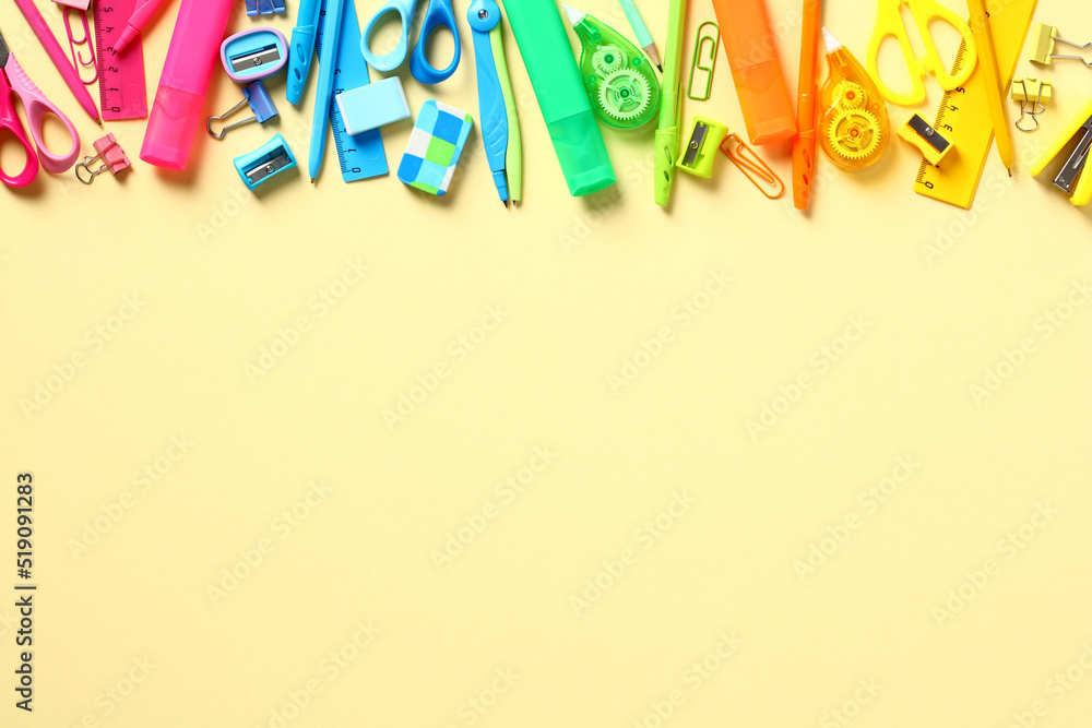 Colorful rainbow school supplies on yellow background. Frame border ...