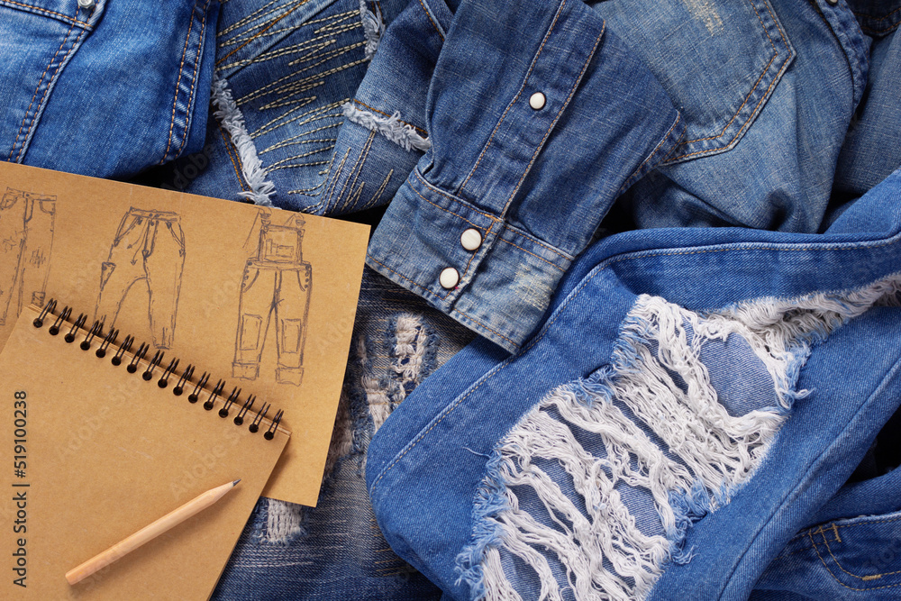 Jeans denim with designer drawing sketches. Blue jeans as background ...