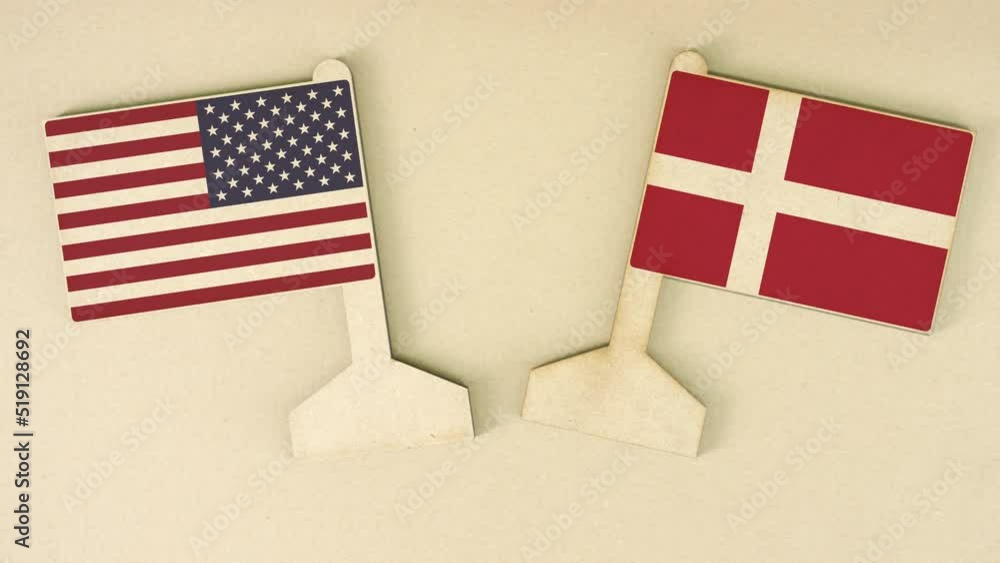 Holding flags of the USA and Denmark made of recycled paper on the ...